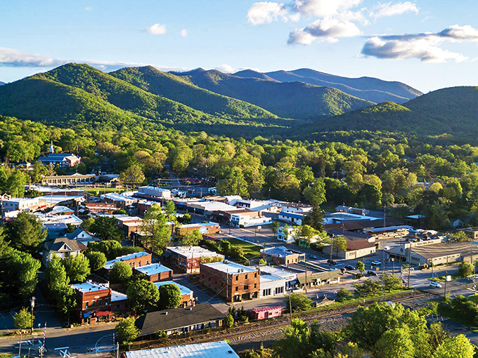 From above, Black Mountain reveals its perfect nestling spot in the valley, surrounded by the protective embrace of the Seven Sisters mountain range.