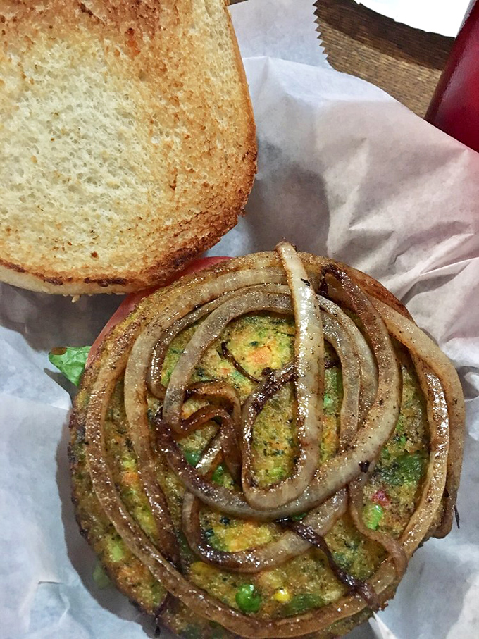 A veggie burger that could convert even the most dedicated carnivore, topped with a hypnotic spiral of caramelized onions.