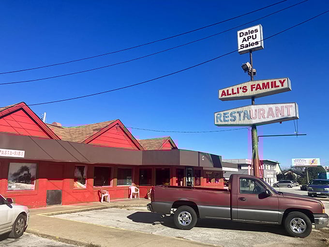 The iconic red roof of Alli's Family Restaurant stands out like a beacon for hungry travelers seeking comfort food salvation.