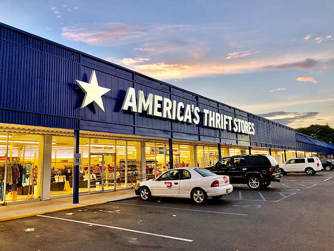 The blue beacon of bargain heaven! America's Thrift Store in Alabaster glows at dusk like a mothership calling all deal-hunters home.