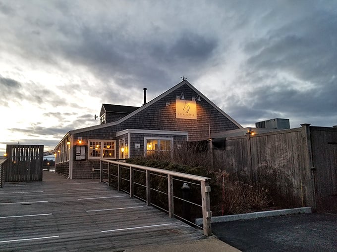 Breakwater at dusk – where weathered shingles and golden light promise seafood that's worth crossing state lines for.