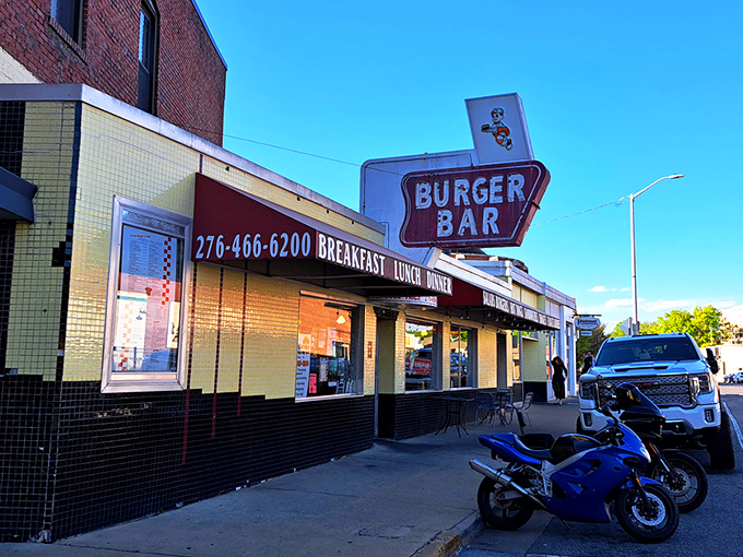 The classic Burger Bar sign beckons like a neon promise. This retro diner in Bristol has been feeding hungry travelers longer than some highways have existed.
