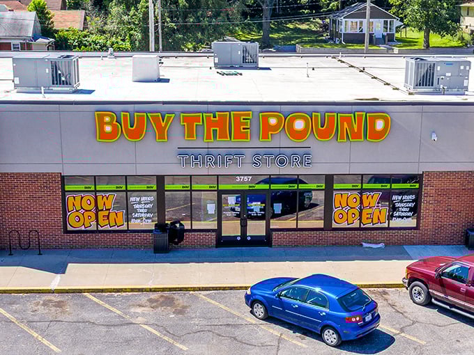 The neon green "BUY THE POUND" sign welcomes bargain hunters to a shopping experience that's more produce section than clothing store!