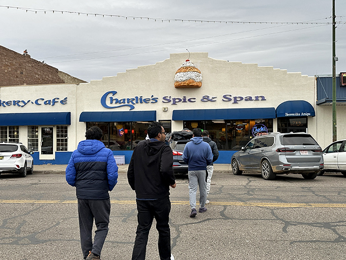 Charlie's Spic & Span's iconic blue awnings and adobe facade - where locals line up before sunrise for breakfast that's worth waking up for!