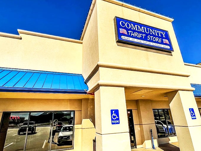 Community Thrift Store stands proud under the Oklahoma sky, its blue awnings like welcome flags for bargain hunters ready for adventure.