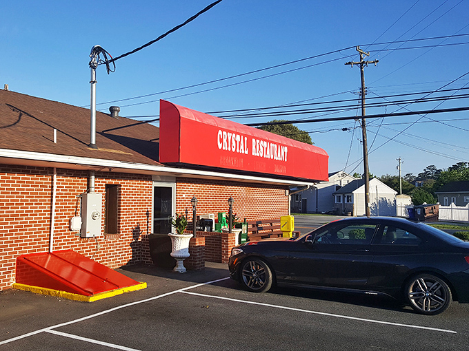 The Crystal Restaurant's iconic red awning stands like a beacon for breakfast pilgrims seeking comfort food salvation.