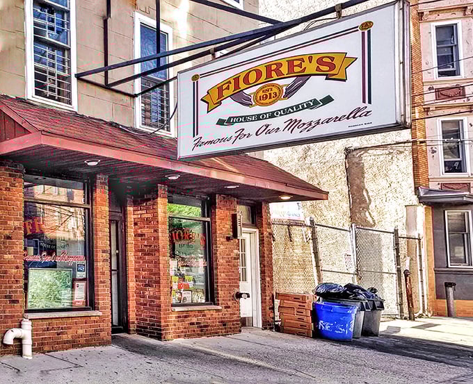 The humble brick storefront of Fiore's Deli - where sandwich dreams come true and locals line up for a taste of Hoboken heaven.