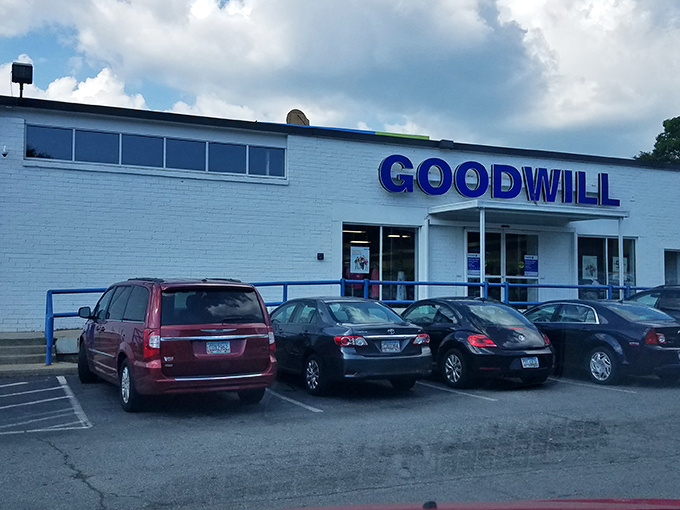 The blue Goodwill sign beckons like a lighthouse for bargain hunters &ndash; a treasure chest where yesterday's splurges become today's steals.