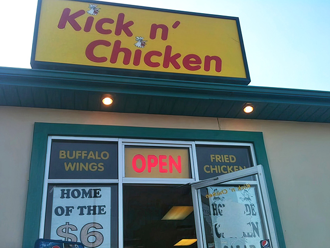 The bright yellow Kick n' Chicken sign – like a beacon of hope for hungry travelers with empty stomachs and big dreams.