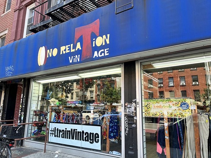 The blue storefront of L Train Vintage beckons like a portal to fashion's time machine. Treasure hunting has never looked so colorful!