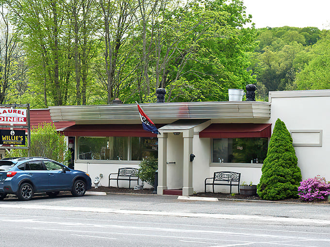 The Laurel Diner's classic red awnings promise comfort food that'll warm your soul faster than your morning coffee.