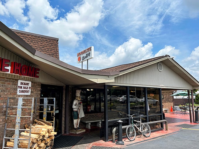 Moonlite Bar-B-Q Inn's humble exterior hides BBQ royalty. That stack of hickory wood isn't just decoration&mdash;it's a promise of smoky perfection waiting inside!