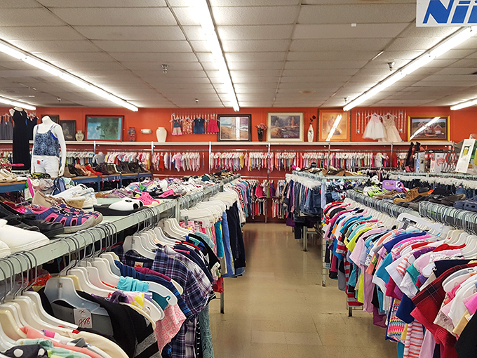 A technicolor dream coat of clothing racks! Where fashion treasures await behind every hanger.
