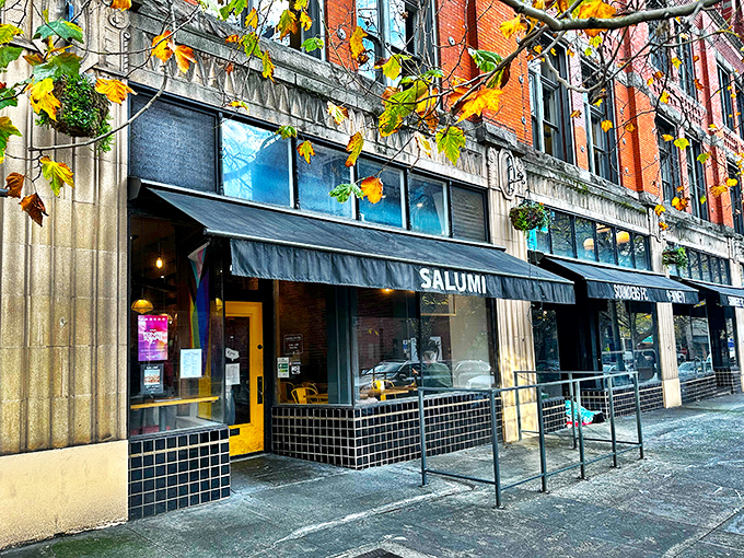 Salumi's iconic storefront with its black awning and yellow door &ndash; like finding the entrance to a secret Italian food society.