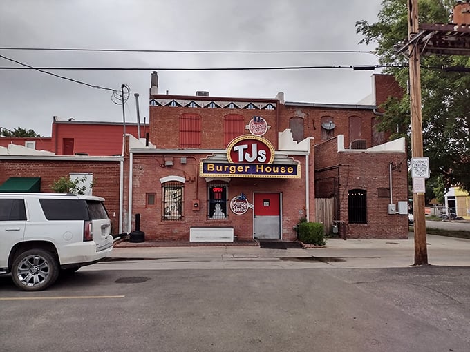 The brick facade of TJ's Burger House beckons like a neon-lit temple to burger perfection. History and flavor collide at this Wichita landmark.
