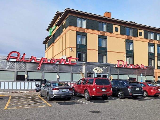 The Airport Diner's iconic neon sign promises a first-class ticket to breakfast paradise, no boarding pass required.