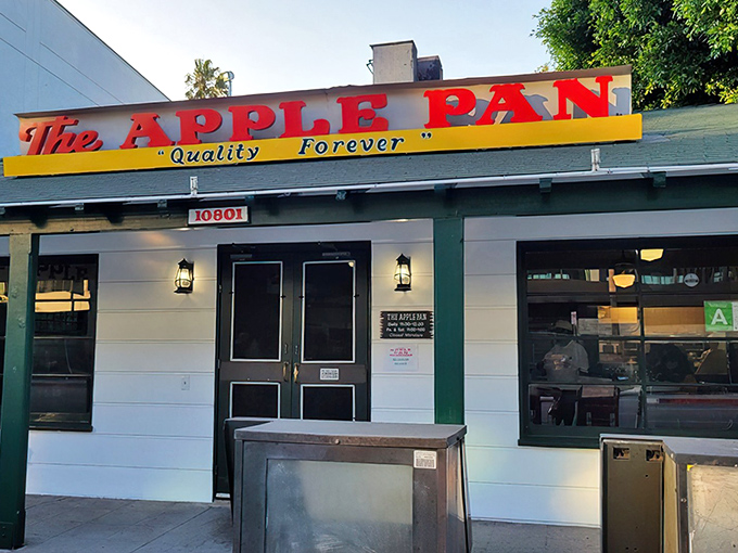 The Apple Pan's iconic storefront promises a time-traveling burger experience. That red sign has been guiding hungry Angelenos to burger bliss since Harry Truman was president.