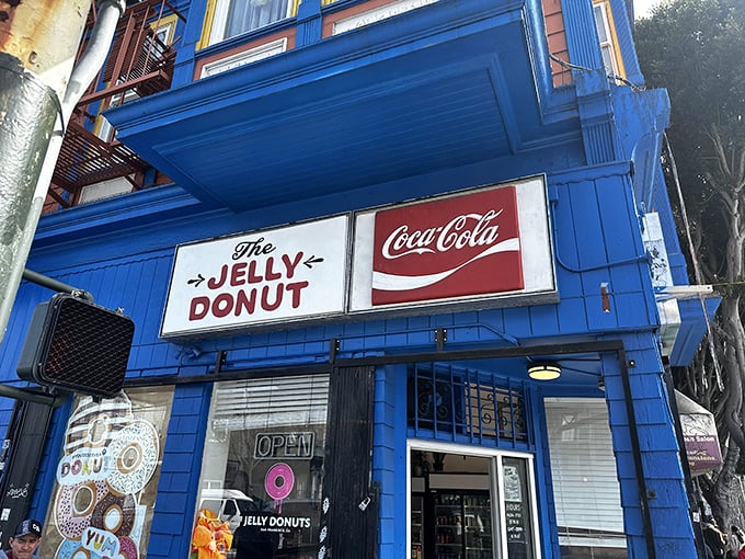 That electric blue facade of The Jelly Donut isn't just a building—it's a portal to sugary nirvana that's been fueling San Francisco's sweet dreams for decades.