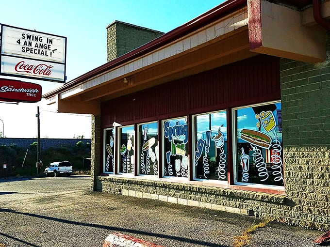 The Sandwich Tree's neon-style window art and vintage sign promise simple pleasures done right. This Idaho Falls institution speaks the universal language of stacked meats.