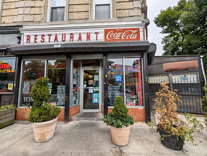 Tom's Restaurant beckons with its classic Coca-Cola sign &ndash; a time capsule of Brooklyn breakfast culture that's been feeding souls since before Instagram existed.