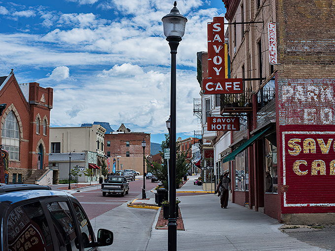 Trinidad's historic Savoy Hotel sign stands as a neon beacon to the past, where brick streets and vintage lampposts create a time-travel experience without the DeLorean.