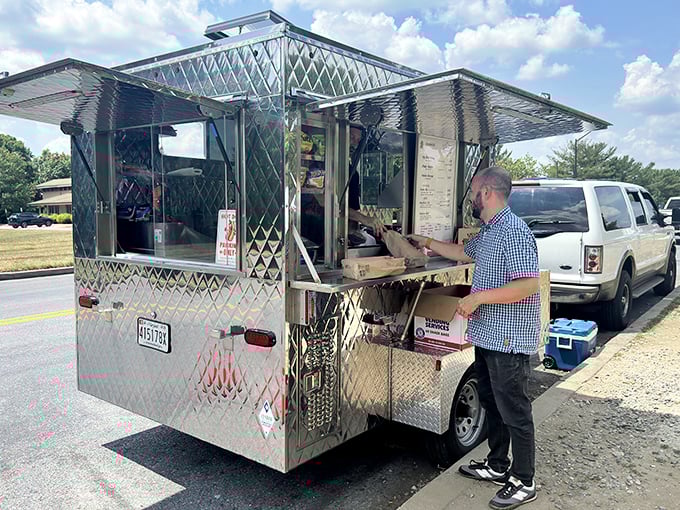 Wayne's gleaming silver hot dog cart—a space-age diner on wheels bringing joy one dog at a time.