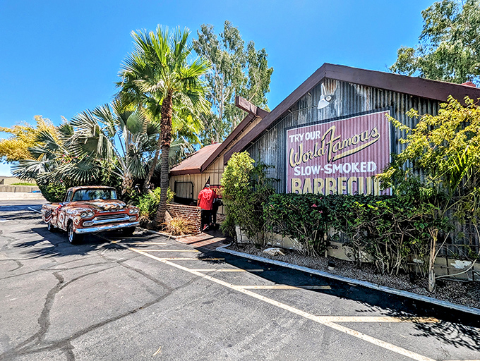 Like finding a honky-tonk in paradise—palm trees meet slow-smoked perfection at this corrugated treasure where vintage cars and vintage techniques collide.