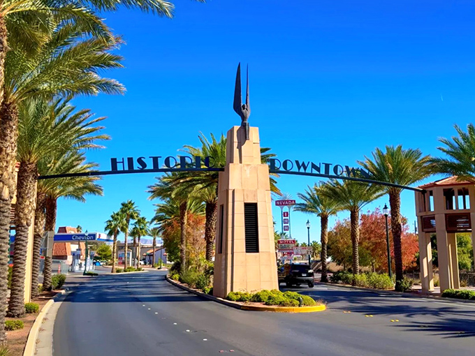 The "Historic Downtown" archway welcomes you to Boulder City, where palm trees and blue skies create Nevada's version of paradise.
