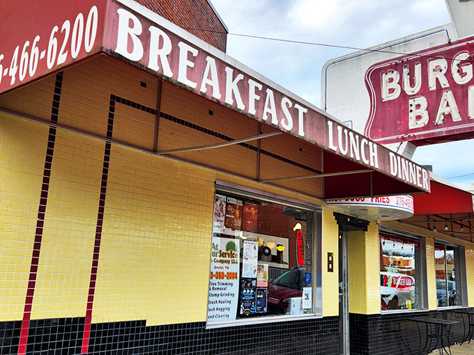 Yellow tiles and checkered patterns scream "authentic roadside diner." The Burger Bar's vintage facade hints at the no-nonsense burger perfection waiting inside.