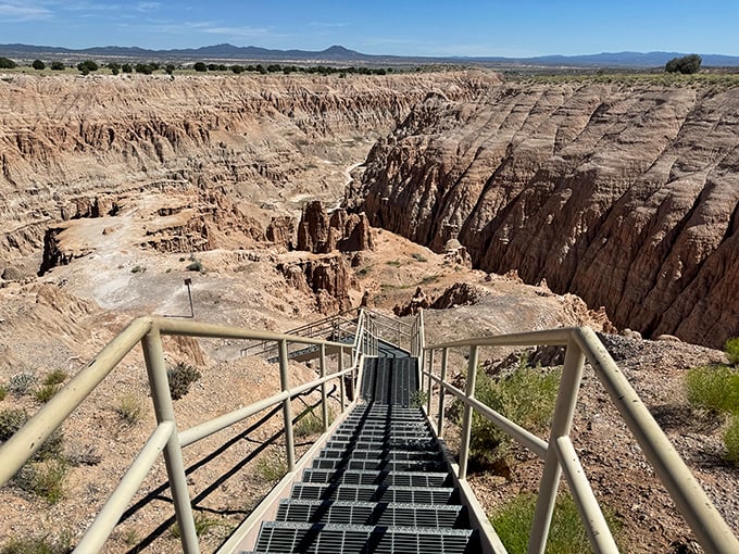 Descending into Cathedral Gorge feels like walking into nature's own sculpture gallery. Those stairs lead to slot canyons narrow enough to touch both walls!