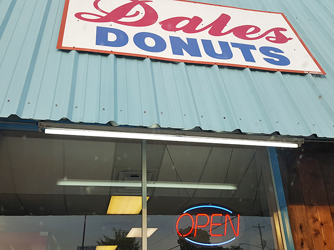 The retro sign promises donuts, but what it delivers is pure, unpretentious joy in fried dough form.