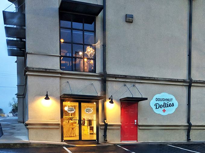 Evening glow illuminates Doughnut Dollies' welcoming storefront. Like finding a little dessert lighthouse guiding you to carb-filled happiness.