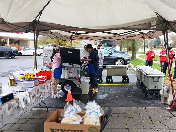 Rain or shine, Garcia's team keeps the grill sizzling. That telltale snap of a perfect hot dog is worth standing in line for.