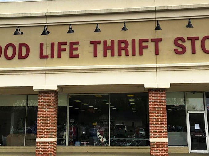 The red lettering beckons bargain hunters like a lighthouse for the frugally fashionable. Donations welcome, amazing finds guaranteed.