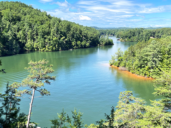 The view that launched a thousand "I could live here" daydreams. Lake Keowee's emerald waters weaving through ancient mountains.