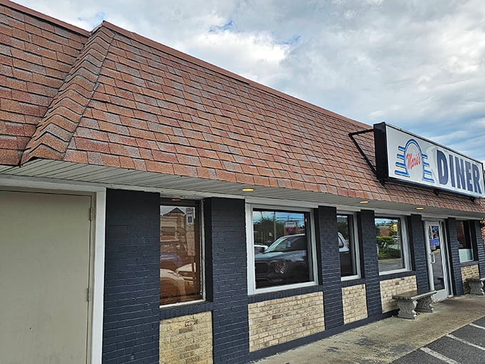 That classic diner façade isn't just charming—it's practically a time machine to when calories didn't count and coffee refills were endless.