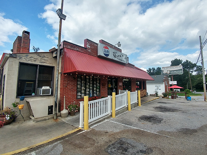 That Pepsi sign might be faded, but the smoke signals from Miss Myra's pit are crystal clear: barbecue magic happens here.