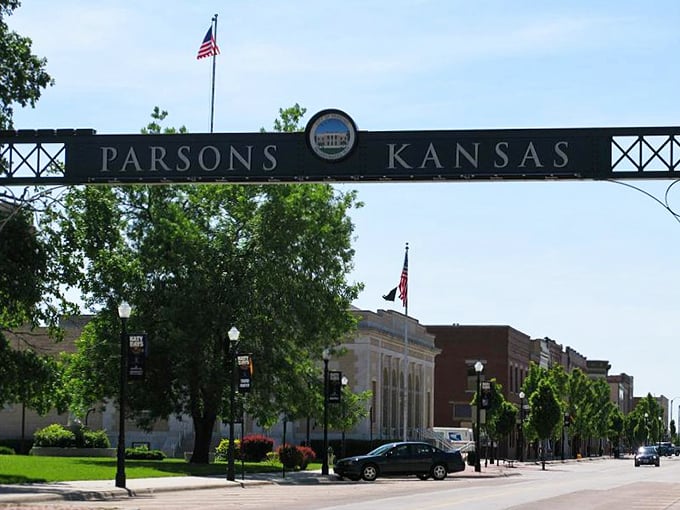 Parsons welcomes visitors with its iconic main street sign, standing sentinel over a downtown where Social Security dollars stretch surprisingly far.