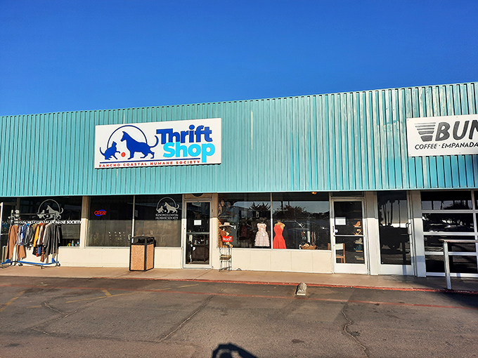 Sidewalk treasures beckon outside this cheery thrift shop. Like a garage sale that got a promotion to management!