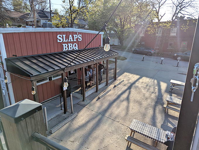 Picnic tables and string lights ready for BBQ bliss at Slap's &ndash; where paper towels are mandatory fashion accessories.