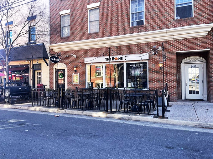 American flags and outdoor seating at The Bone &ndash; where patriotism meets fall-off-the-bone ribs in downtown Manassas.