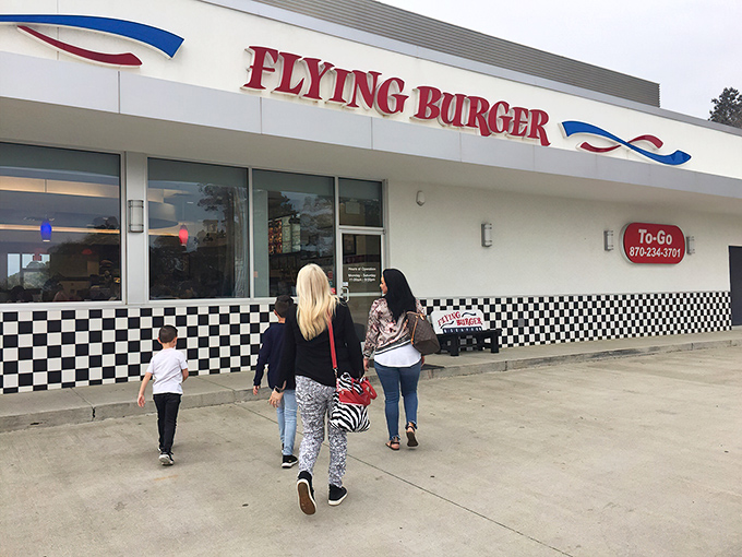 Families making the pilgrimage to burger paradise. That checkered trim isn't just decoration &ndash; it's a finish line for your hunger.