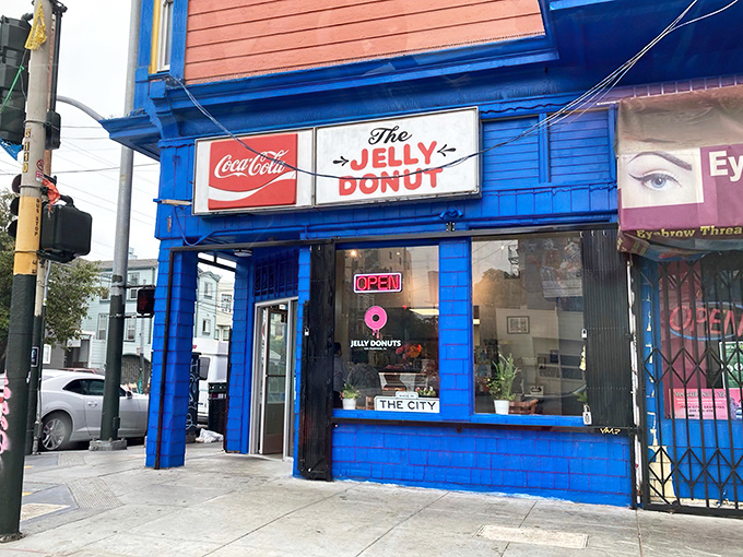No fancy Edison bulbs or reclaimed wood here—just the honest glow of fluorescent lights illuminating what might be the Mission District's most perfect jelly-filled treasures.