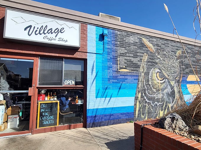 That stunning owl mural guides hungry patrons to Village Coffee Shop like a wise breakfast guardian.