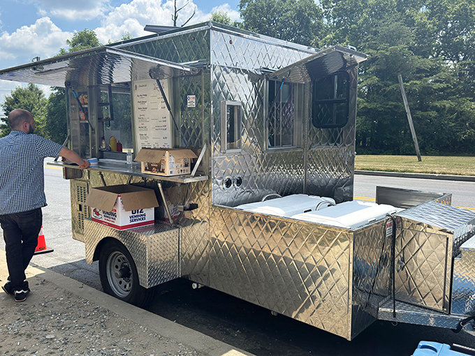 The ultimate curbside service! Wayne's chrome hot dog stand shines brighter than the Maryland summer sun.