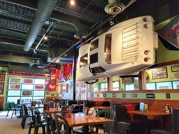Dining under a suspended VW bus might be concerning elsewhere, but here it's just Tuesday. The interior transforms automotive history into a feast for the eyes.