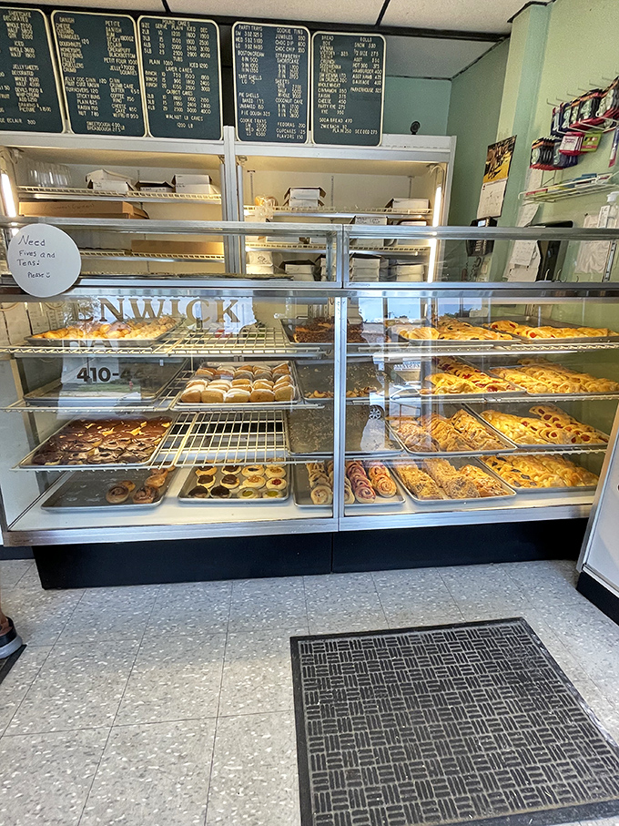 Display cases filled with temptation behind glass – the kind of view that makes diets spontaneously combust and willpower wave a white flag.