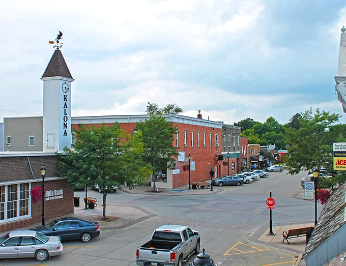 Kalona's iconic clock tower stands sentinel over brick buildings that have witnessed generations of both change and tradition in this unique cultural crossroads.