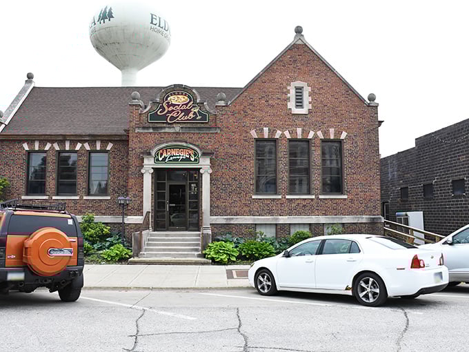 The Eldora Social Club's charming brick exterior promises good times inside. That water tower in the background? It's keeping an eye on the town's pie-to-person ratio.