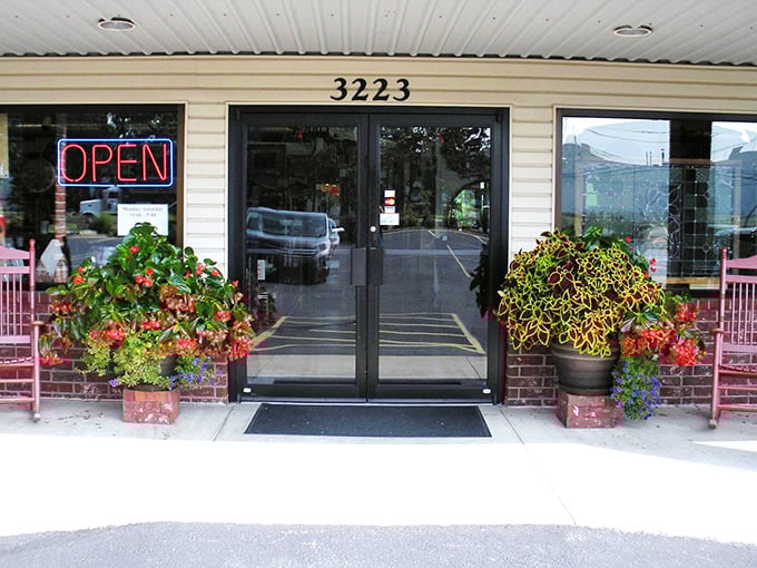 Those pink flower pots aren't just decoration&mdash;they're your first clue that someone inside cares deeply about creating a welcoming experience.
